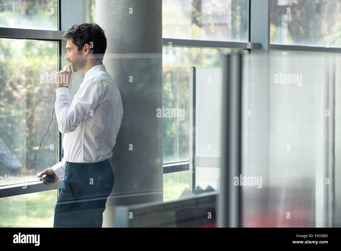Man using phone during work break Stock Photo - Alamy
