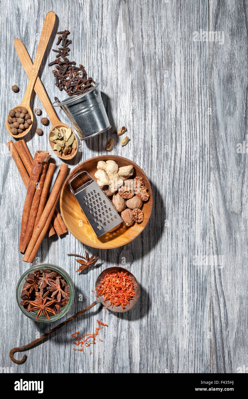 Nutmeg and spices on rustic wood background hi-res stock photography ...