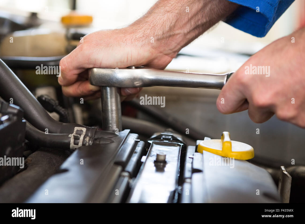 Mechanic working on an engine Stock Photo - Alamy