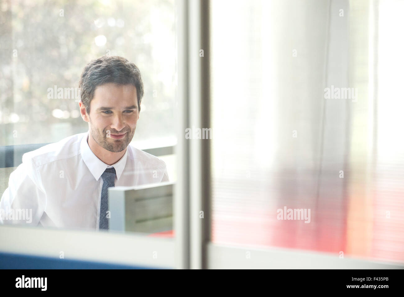 Office worker at work in office Stock Photo - Alamy