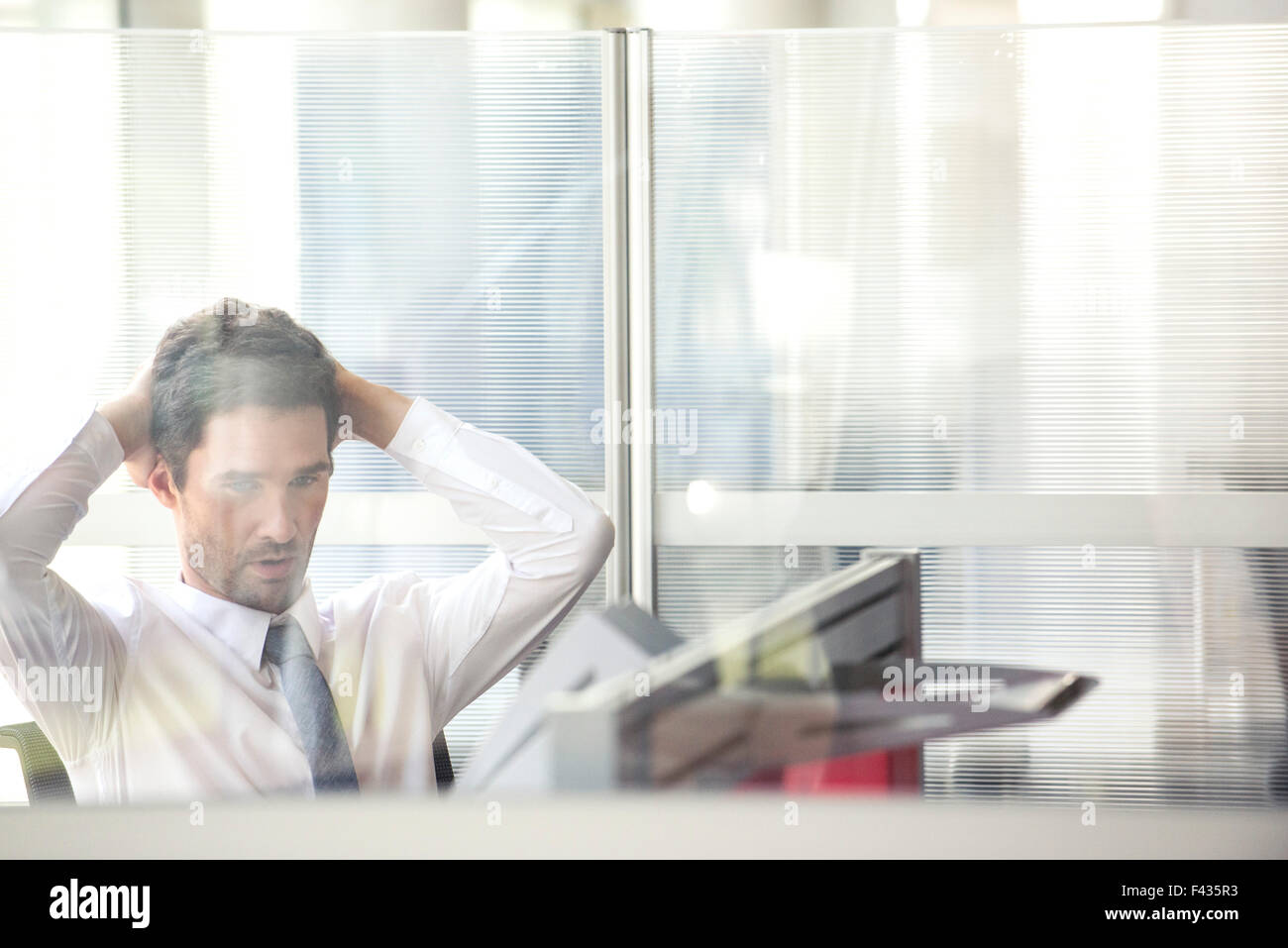 Exhausted office worker taking break Stock Photo - Alamy