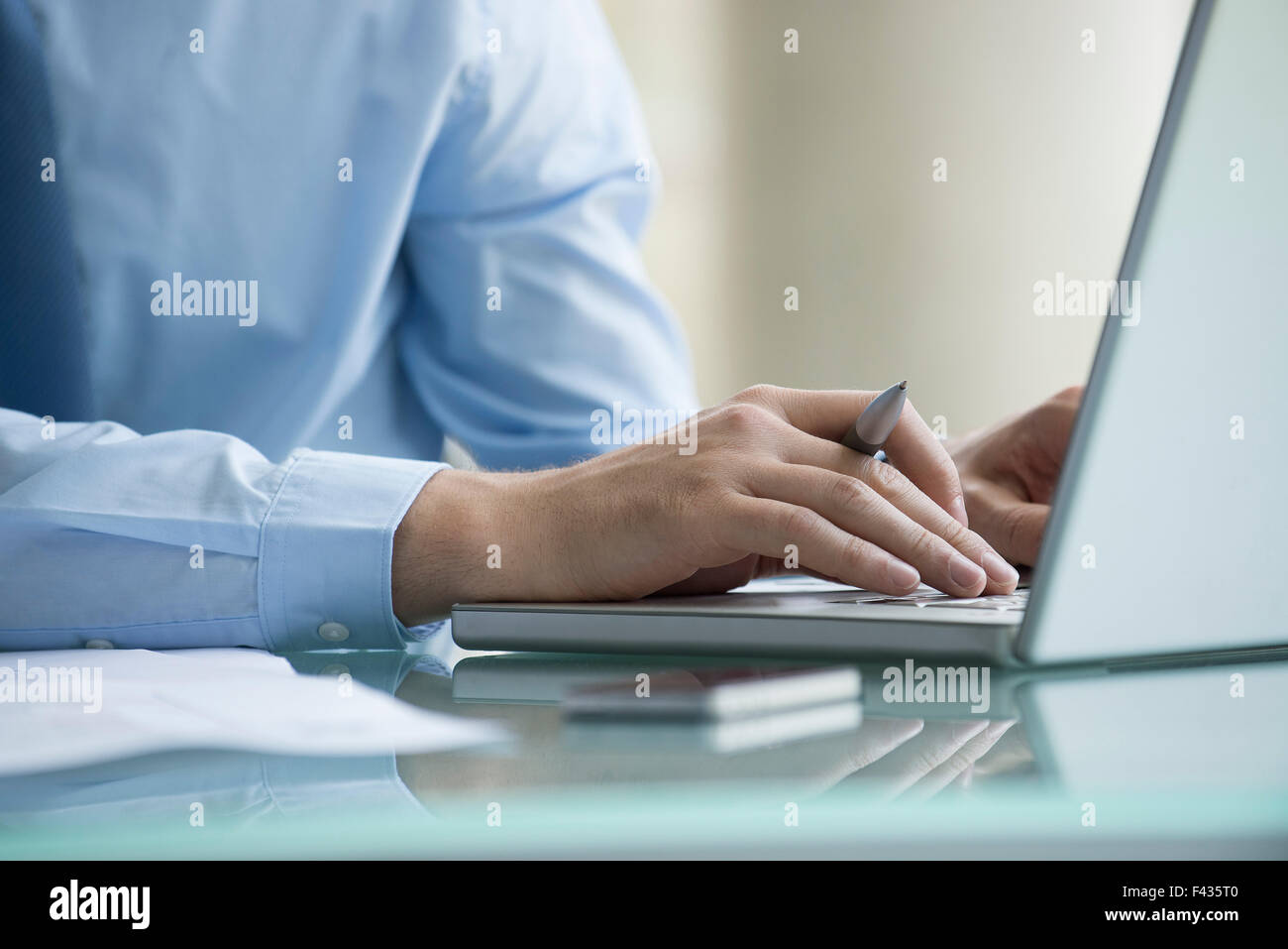 Man using laptop computer Stock Photo - Alamy