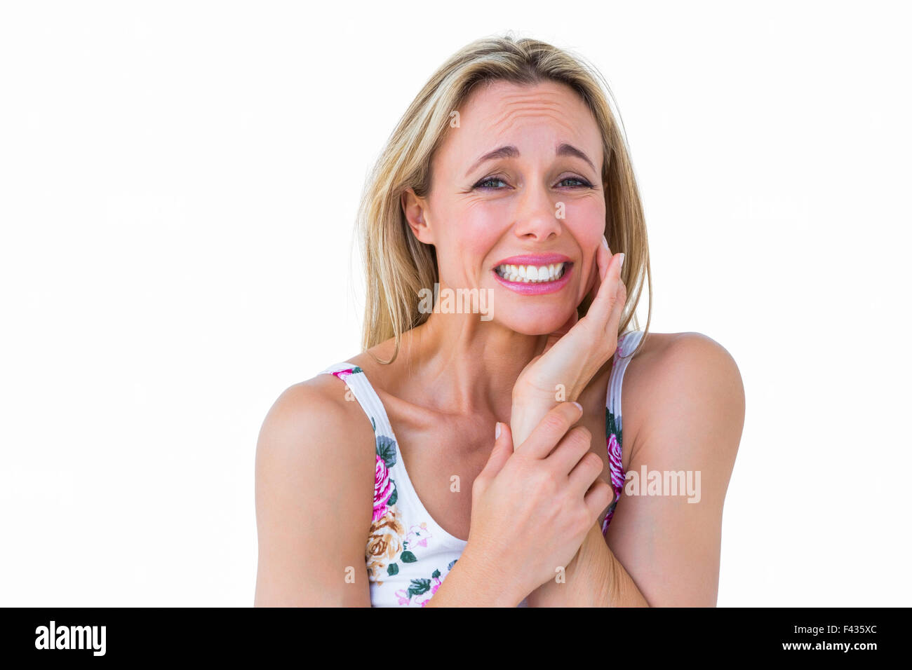 Blonde woman suffering with teeth pain Stock Photo - Alamy
