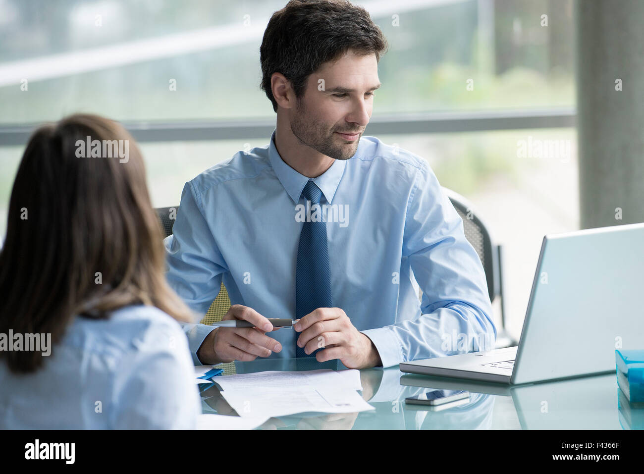 Insurance agent meeting with prospective customer Stock Photo - Alamy