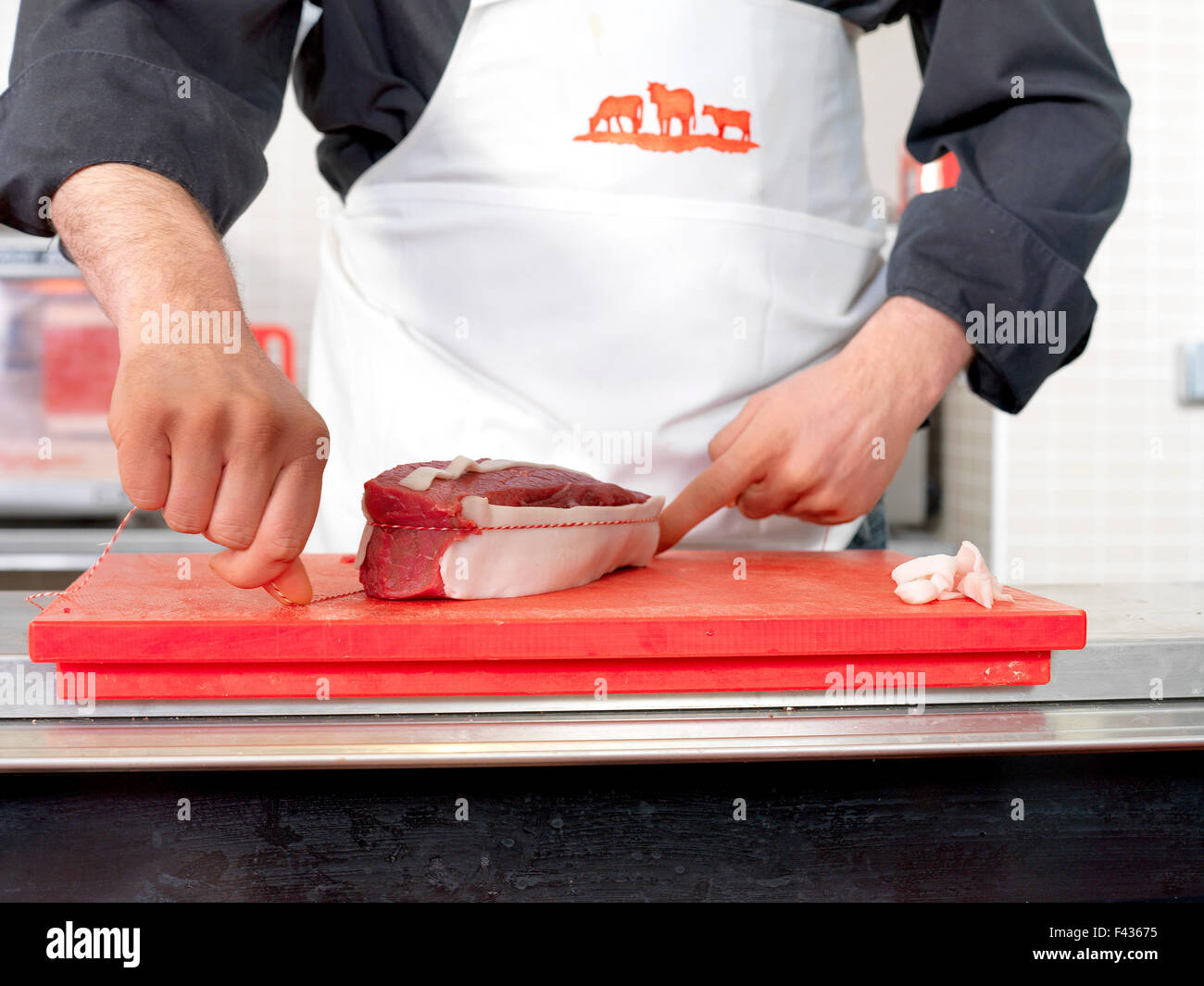 Man chopping meat at meat market hi-res stock photography and images ...