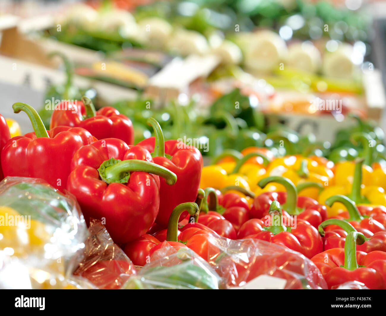 Fresh bell peppers on display at supermarket Stock Photo - Alamy