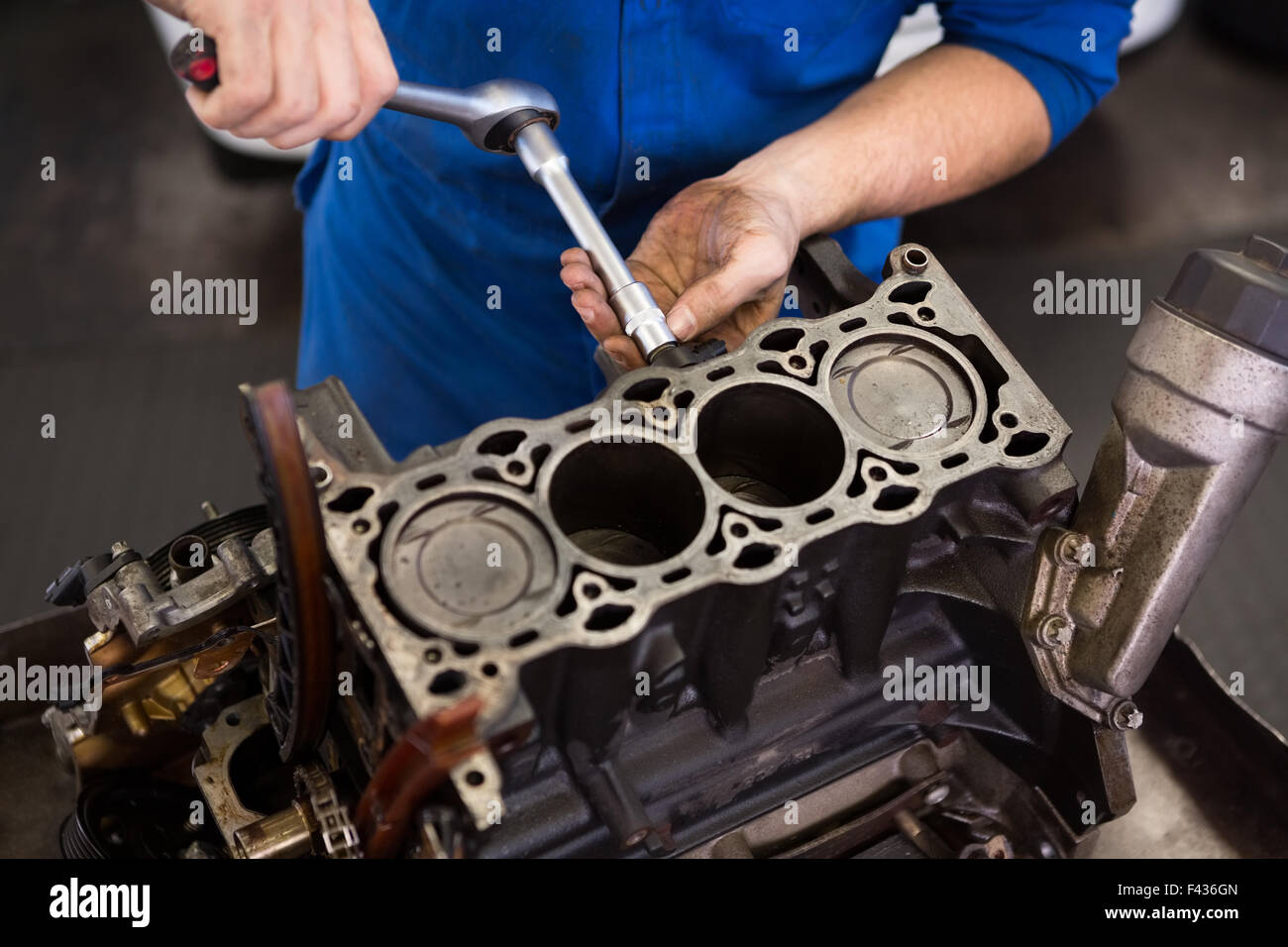 Mechanic working on an engine Stock Photo - Alamy
