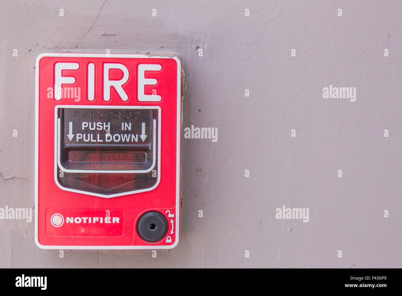 fire alarm mounted on the wall of the building Stock Photo - Alamy