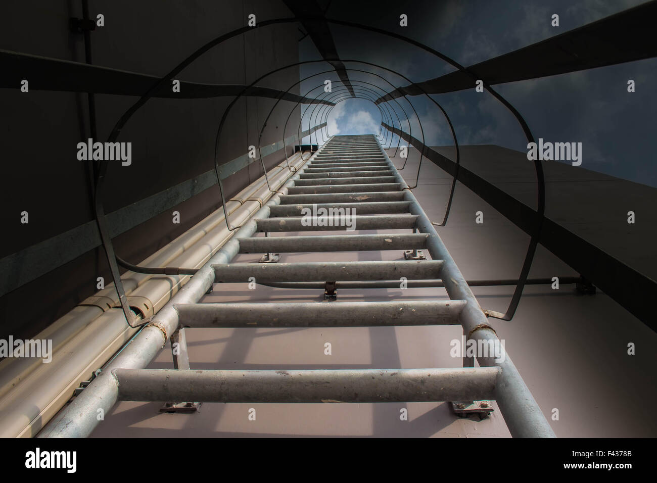 Ladders on the roof of a tall building with a view below Stock Photo ...
