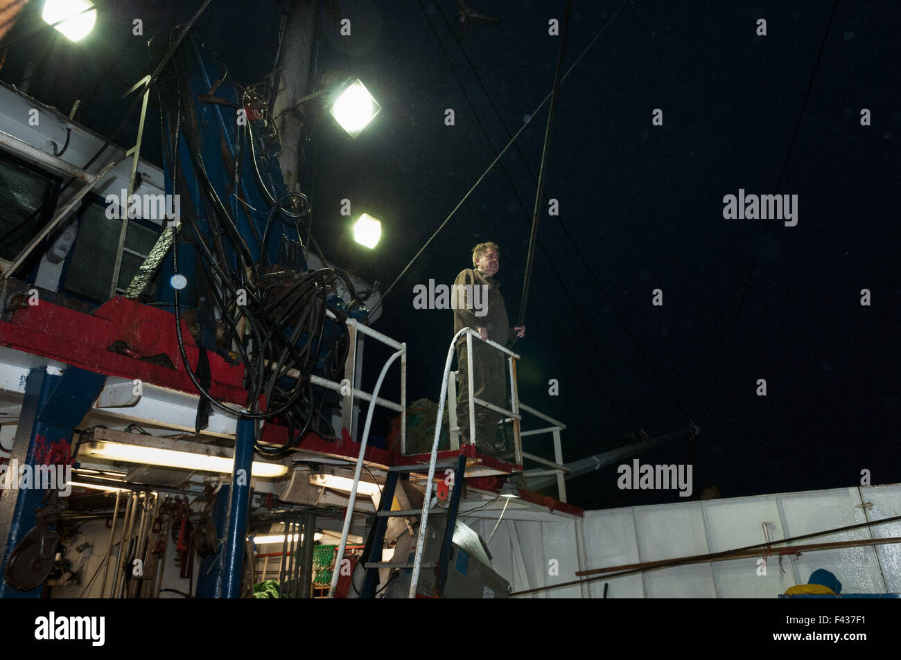 Captain of offshore fishing trawler oversees operations. Georges Bank ...