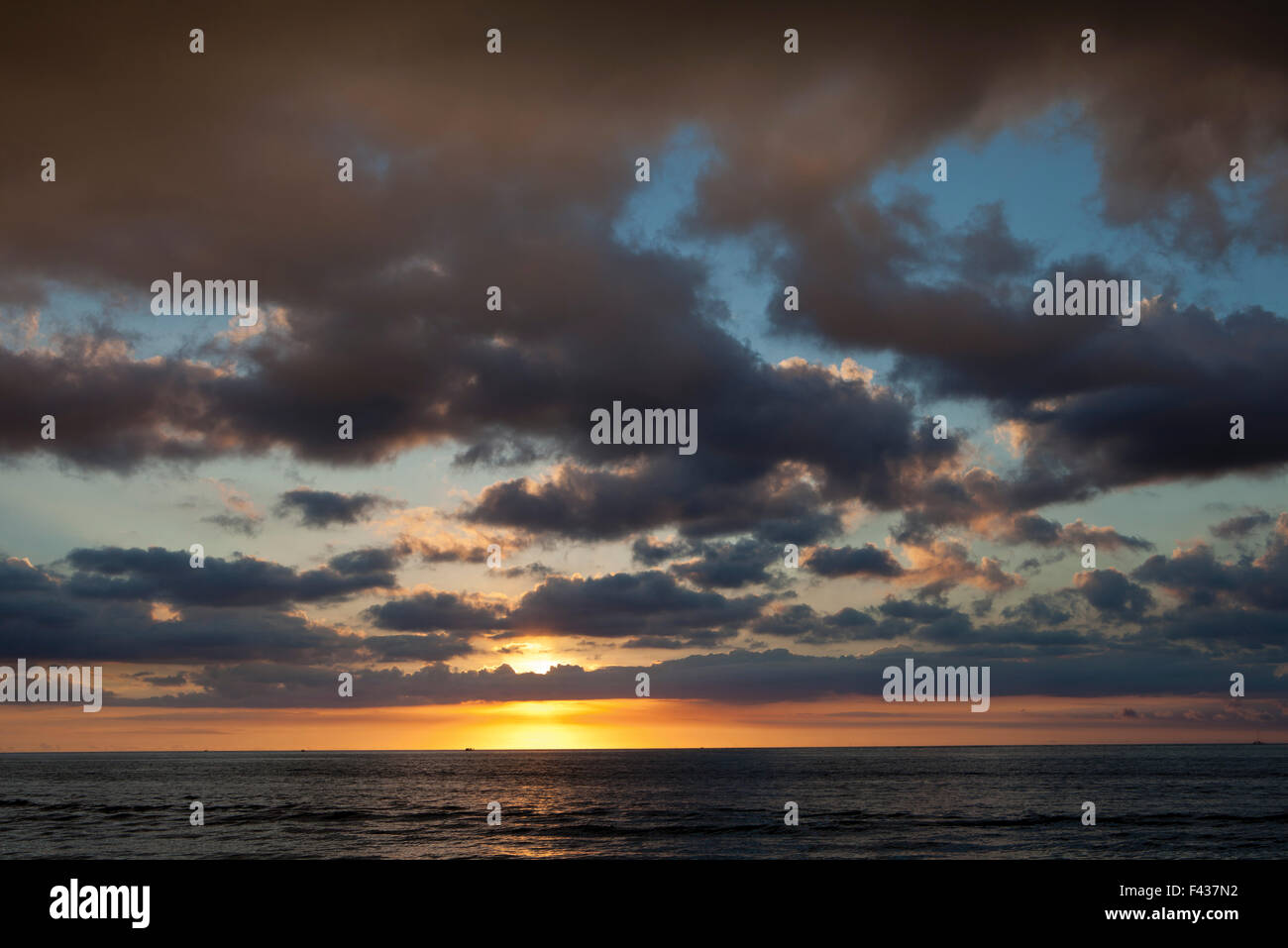 Cloudy sky over sea during sunset Stock Photo - Alamy