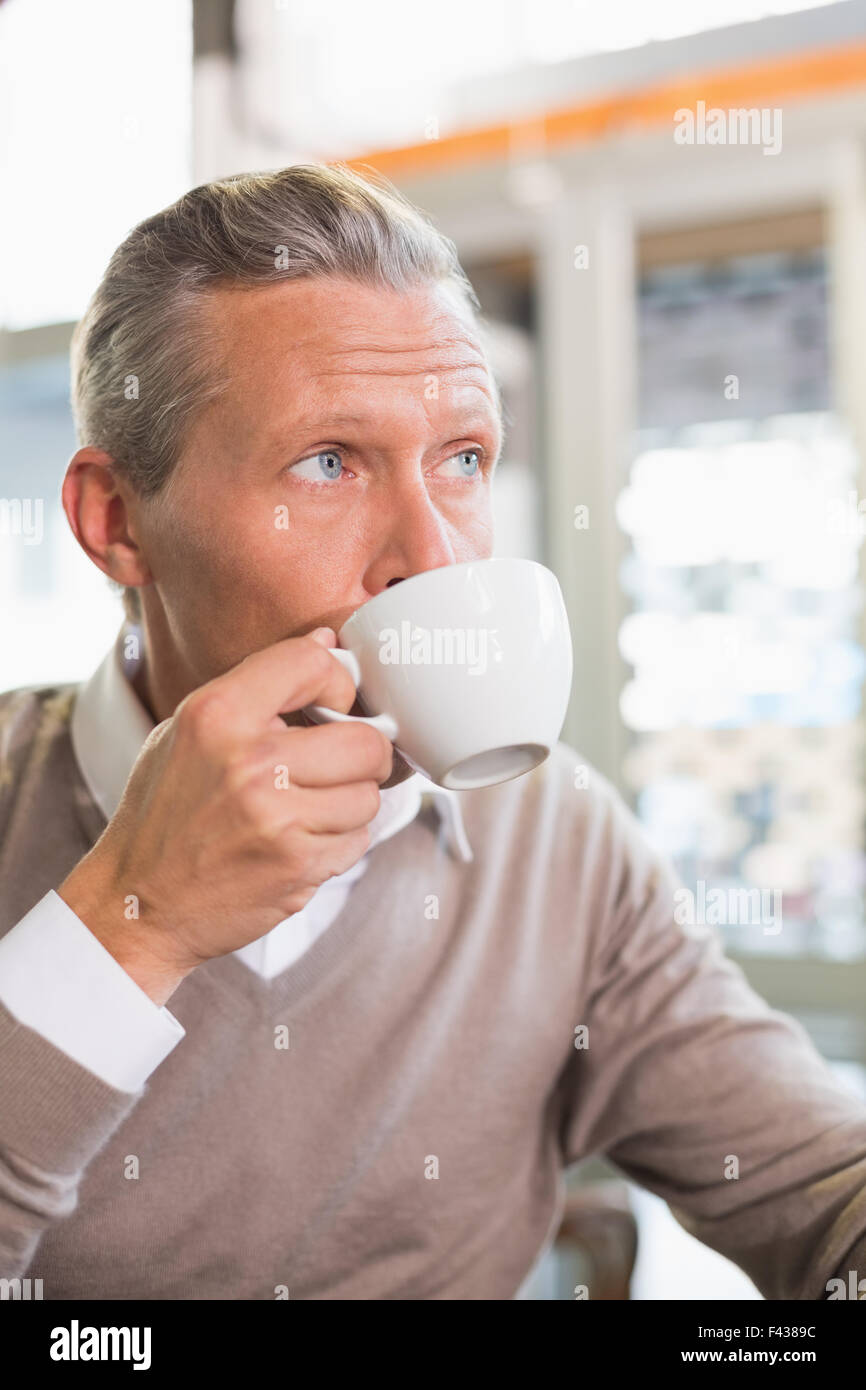 Handsome man having a coffee Stock Photo - Alamy