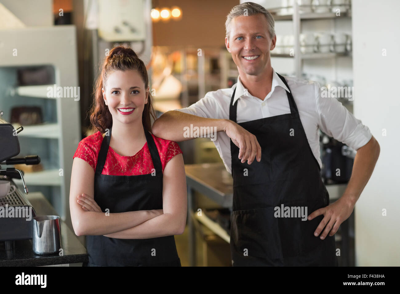 Servers smiling at the camera Stock Photo - Alamy
