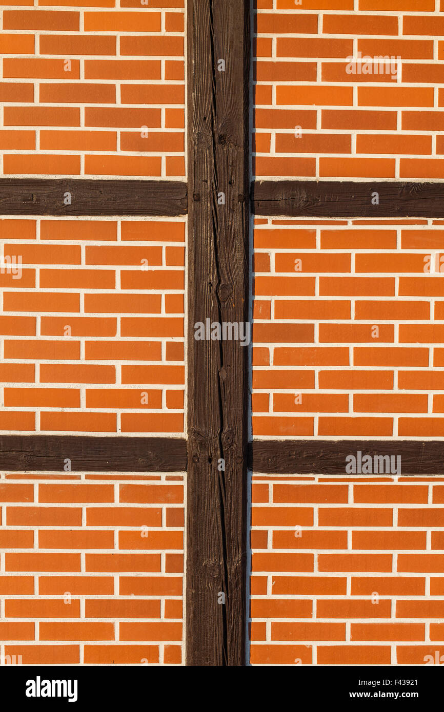Background of renovated brick wall with old wooden post Stock Photo - Alamy