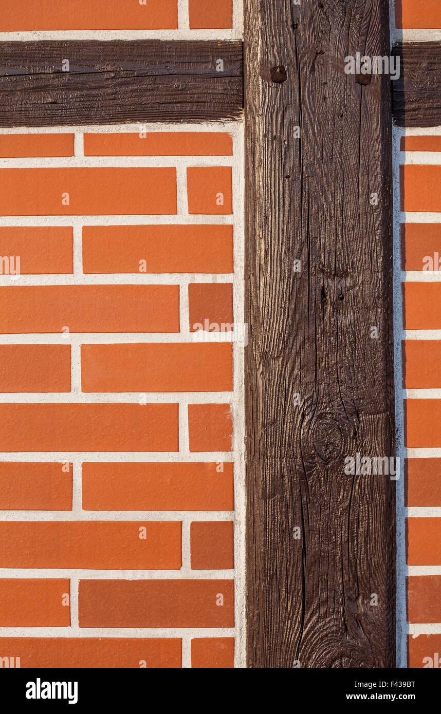 Background of renovated brick wall with old wooden post Stock Photo - Alamy