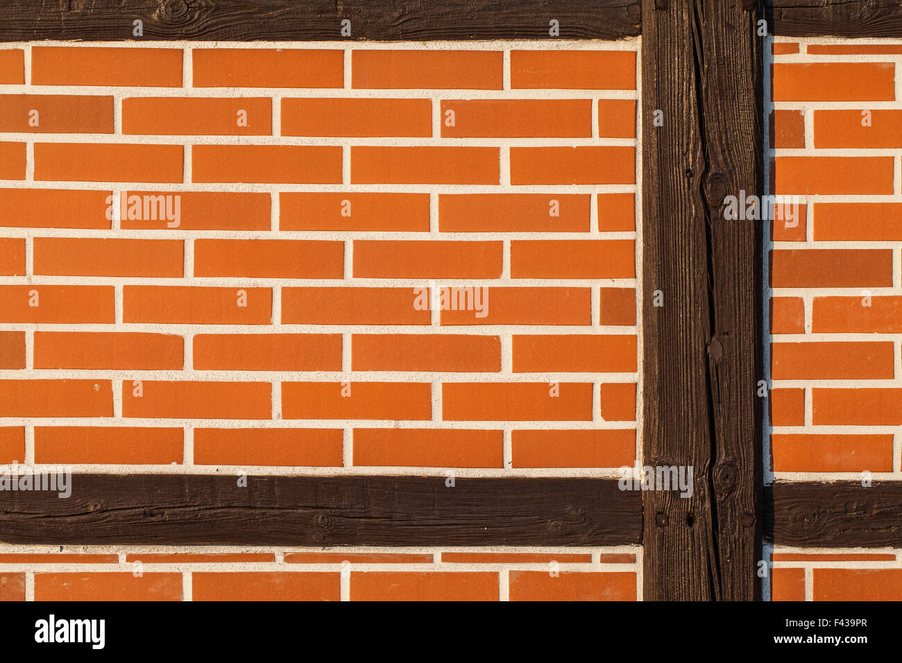 Background of renovated brick wall with old wooden post Stock Photo - Alamy