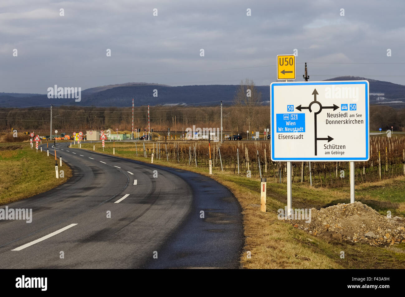 Country road with traffic sign Stock Photo - Alamy