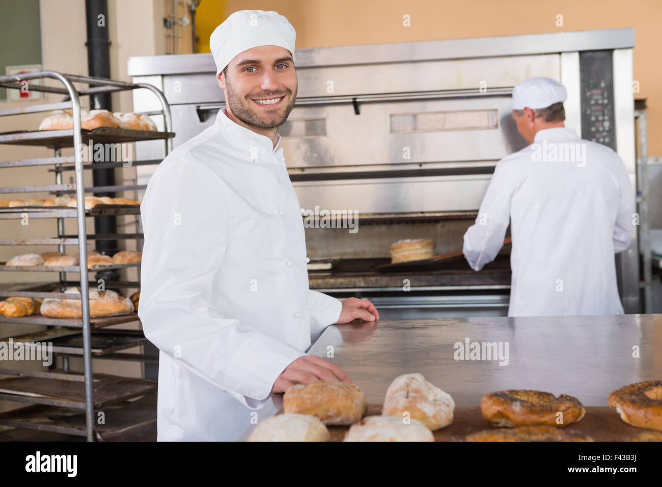 Smiling baker looking at camera Stock Photo - Alamy