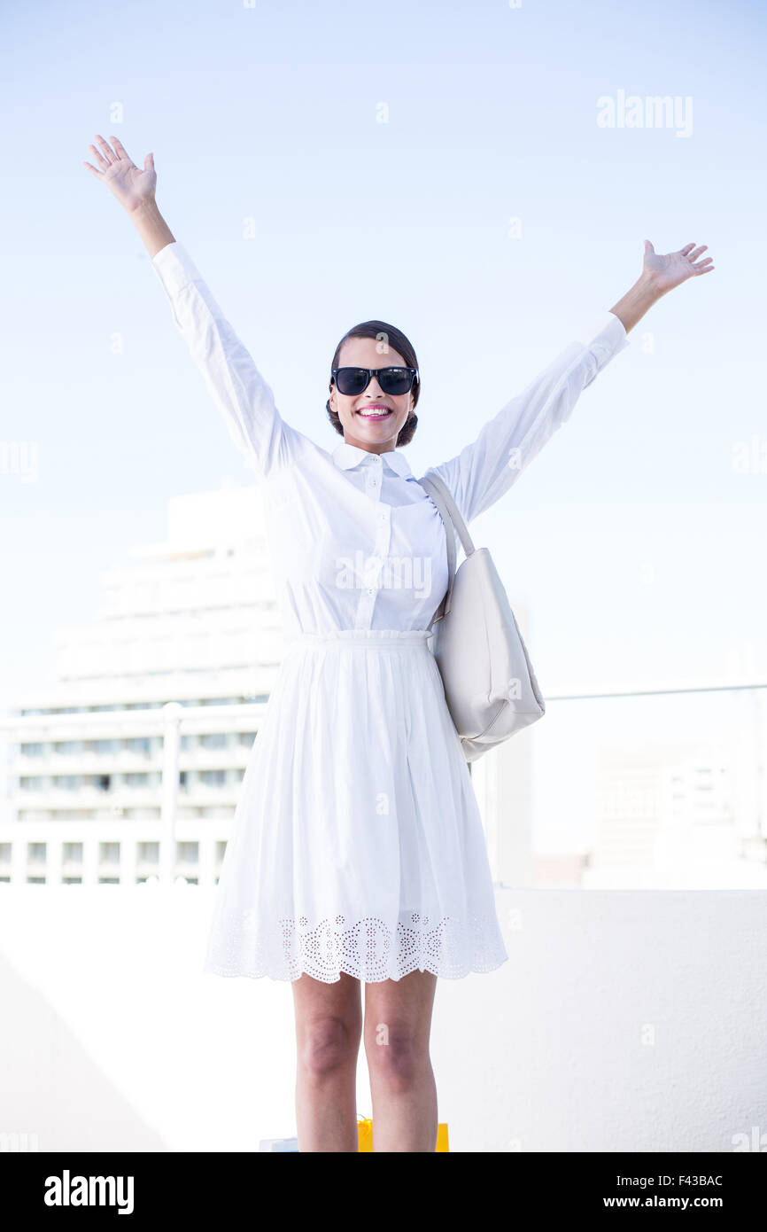 Happy woman raising her hands up Stock Photo - Alamy