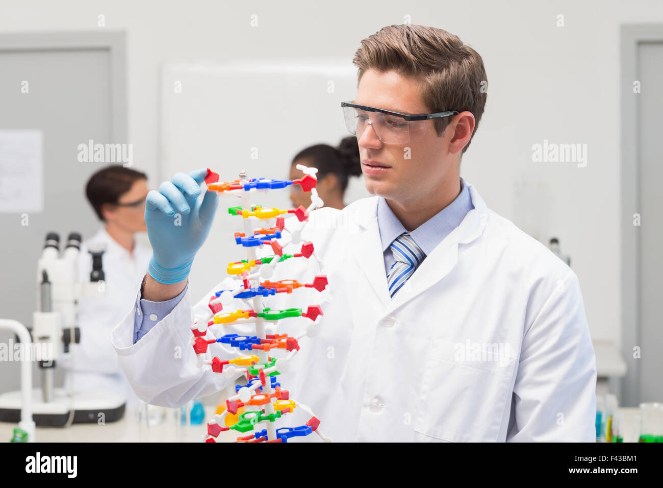 Young scientist making medicine hi-res stock photography and images - Alamy