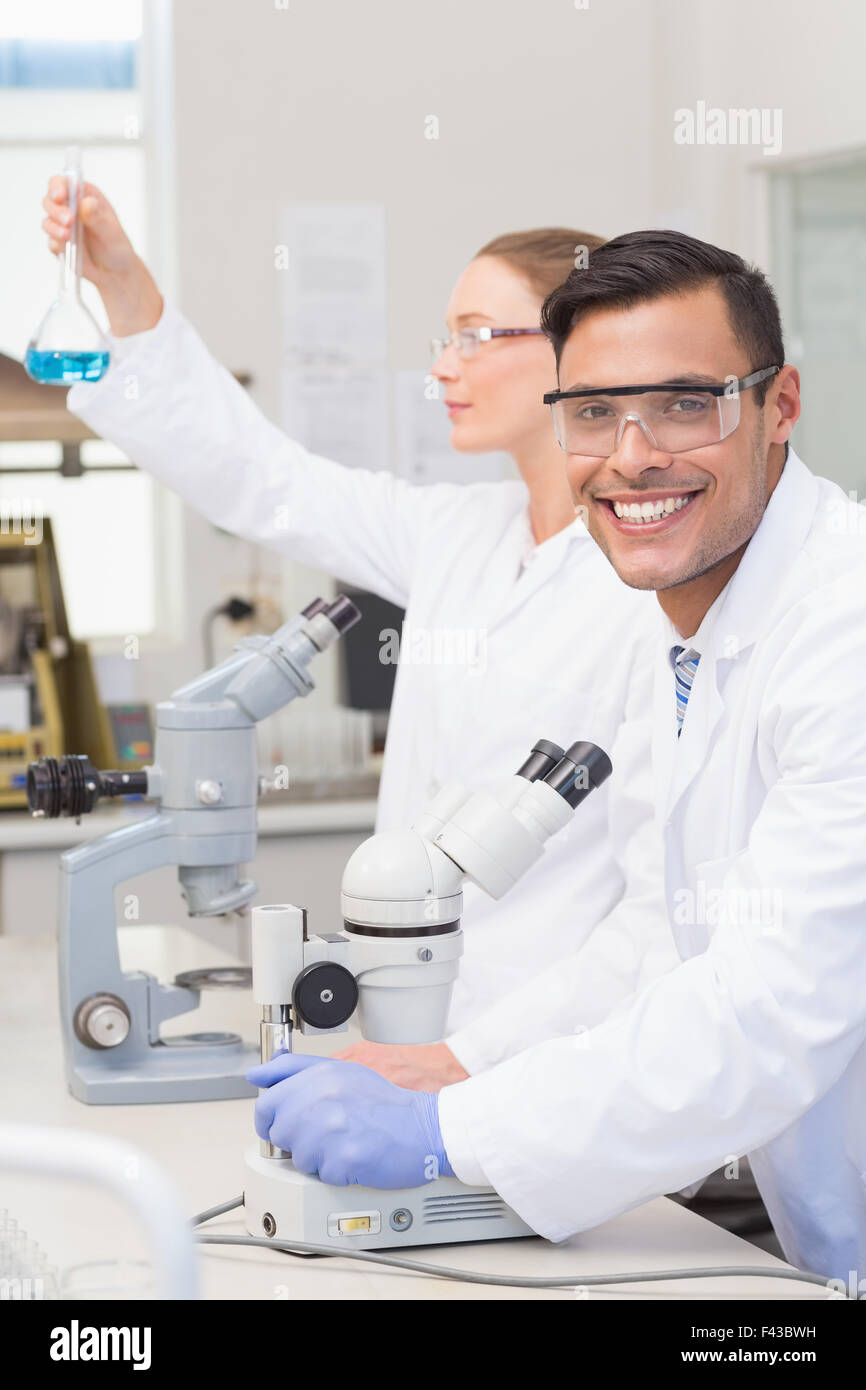 Scientists examining blue precipitate Stock Photo - Alamy