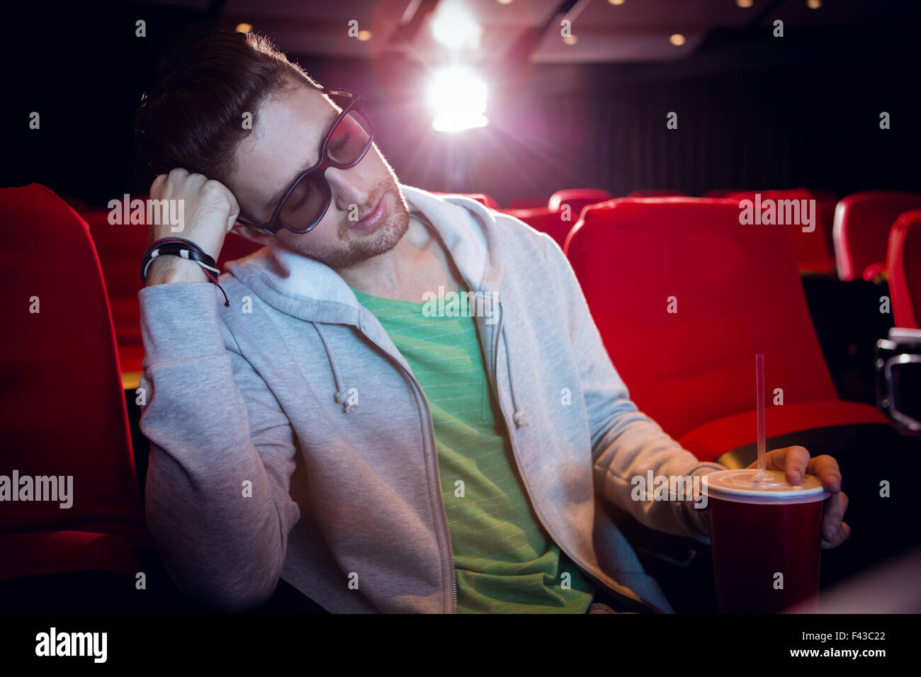 Young man sleeping in chair Stock Photo - Alamy