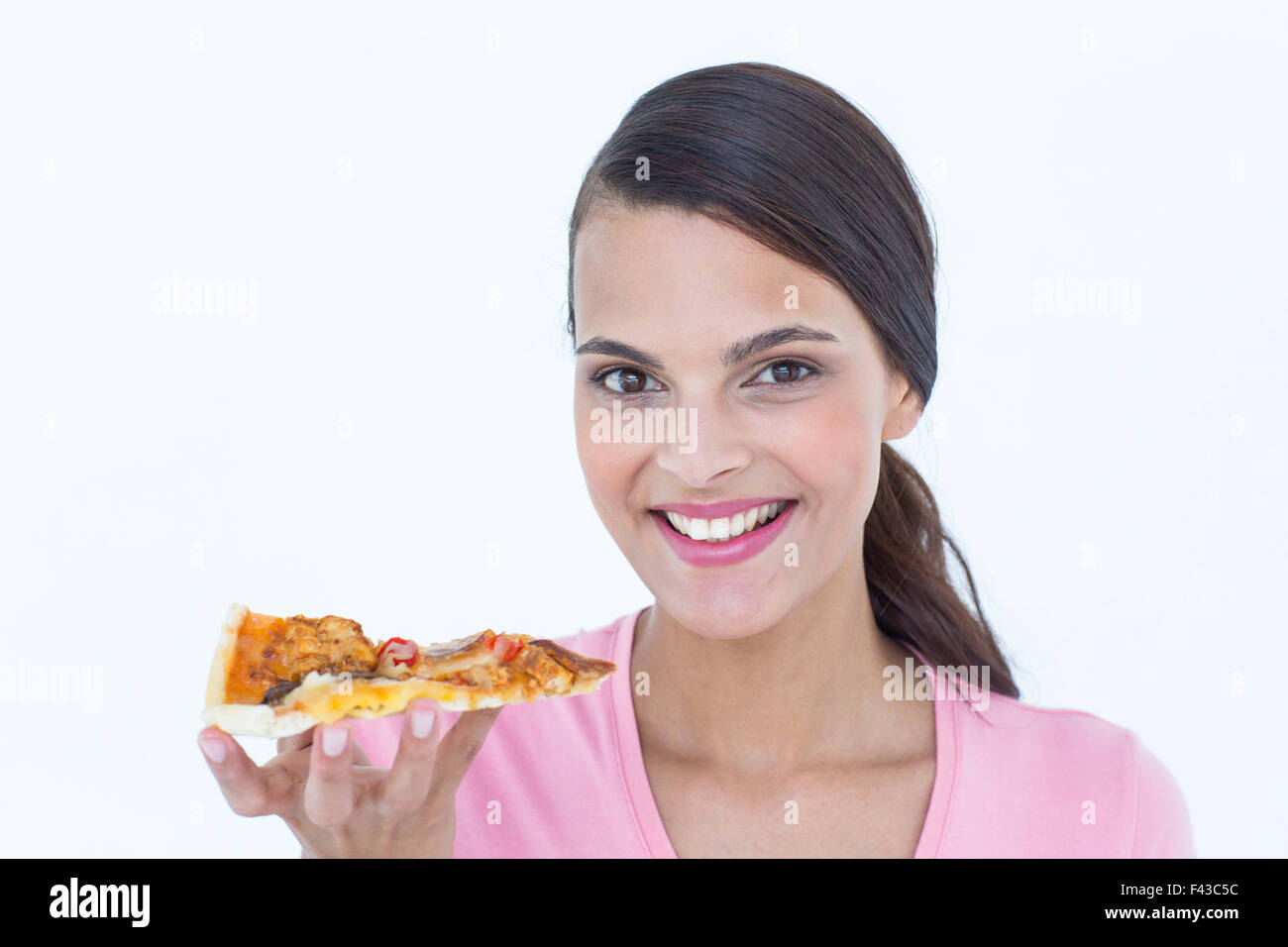 Beautiful woman eating a pizza Stock Photo - Alamy