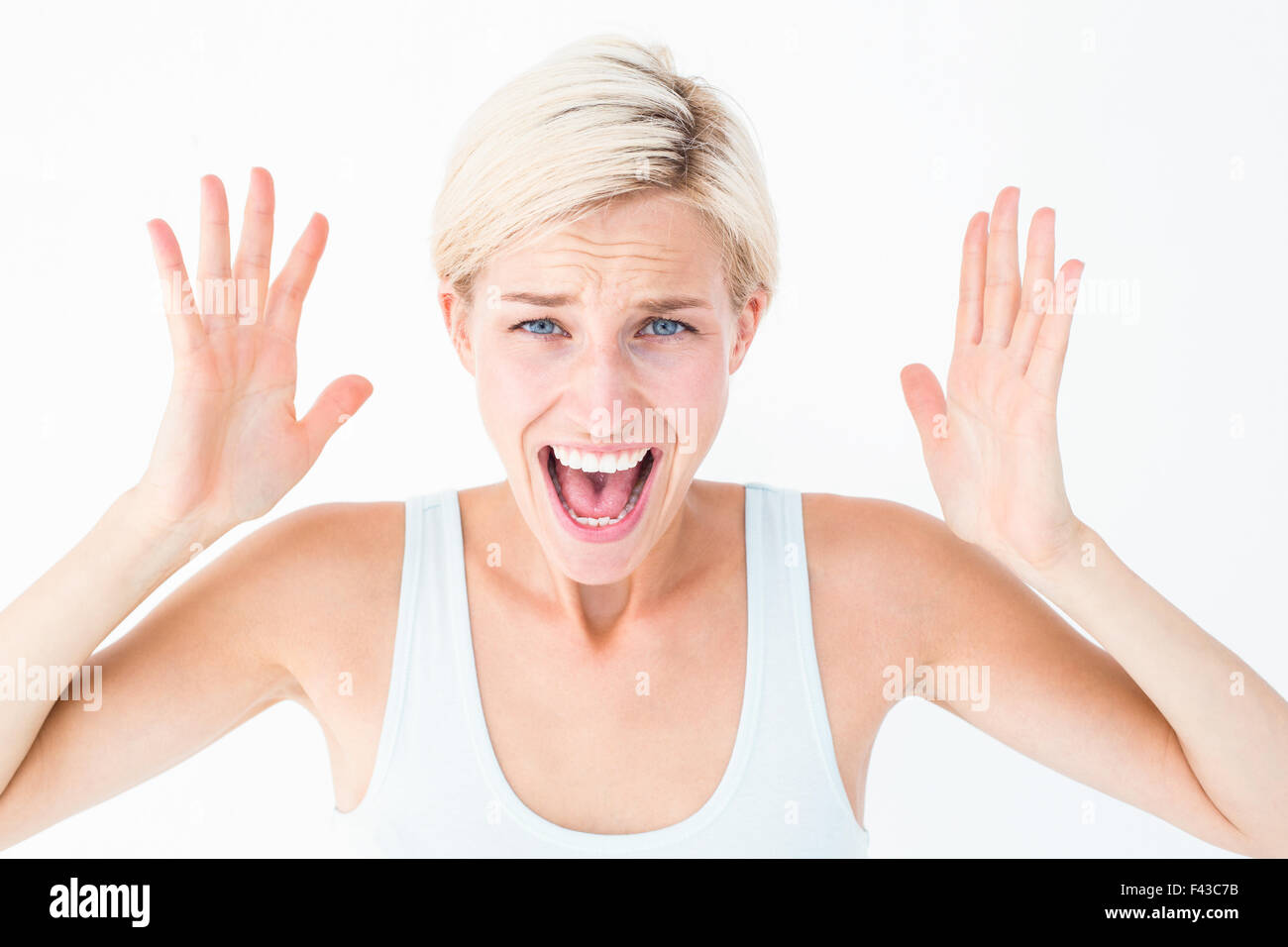 Angry blonde screaming with hands up Stock Photo - Alamy