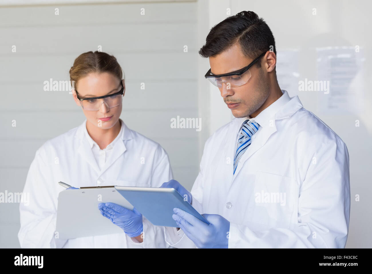 Scientists taking notes Stock Photo - Alamy