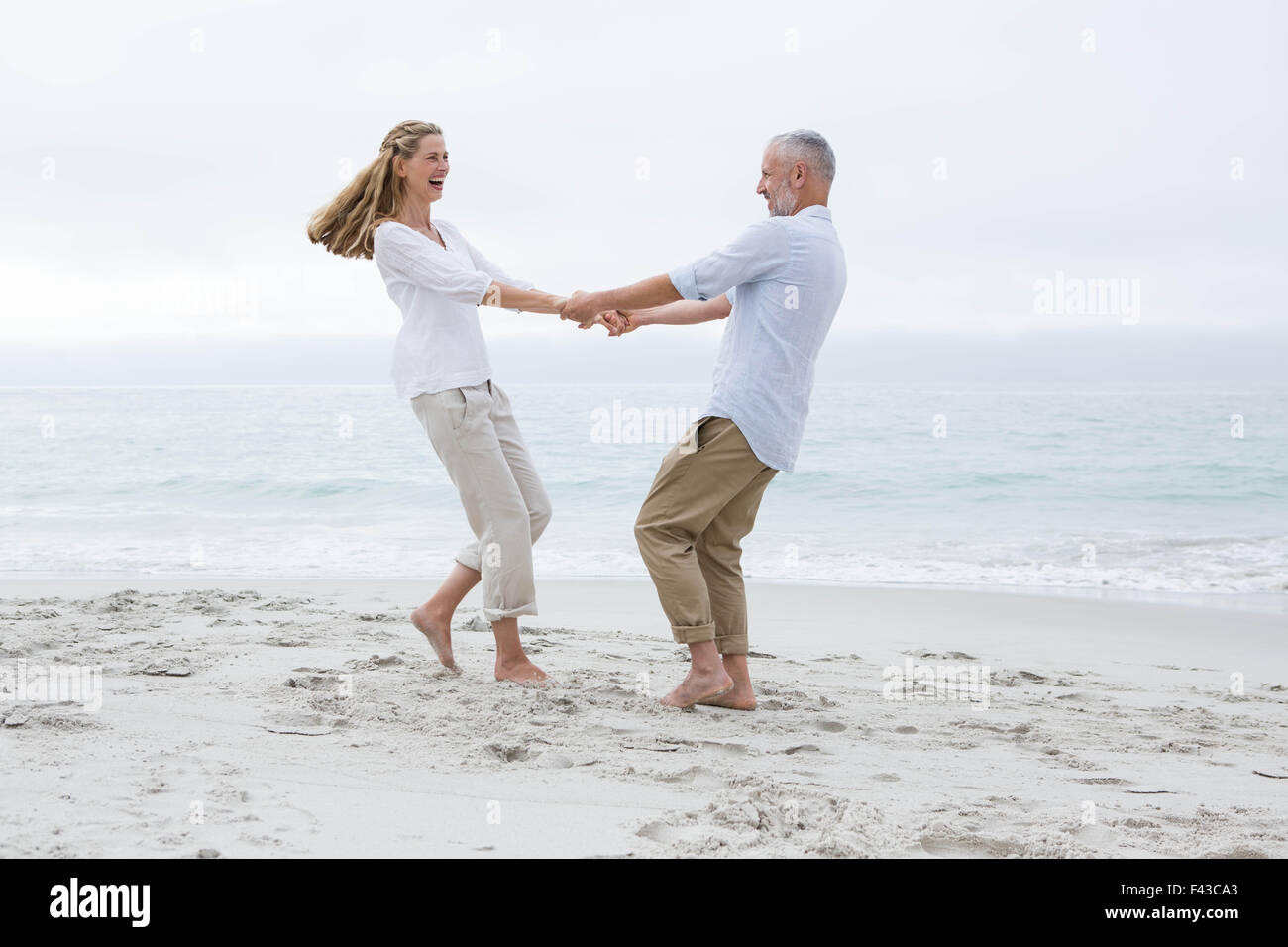 Happy couple having fun together Stock Photo - Alamy