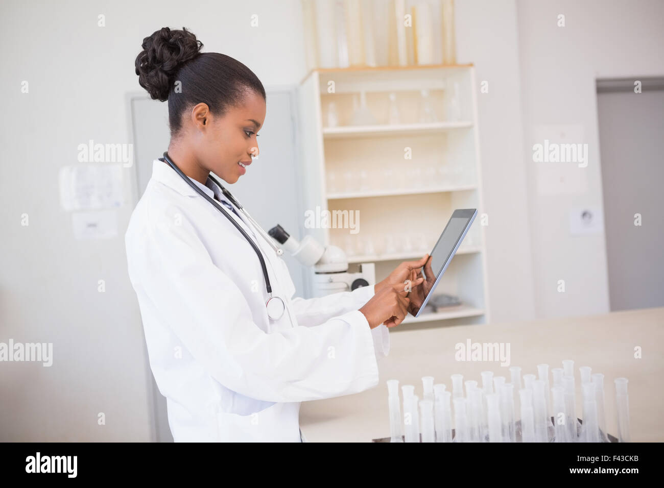 Female laboratory specialist using tablet hi-res stock photography and ...