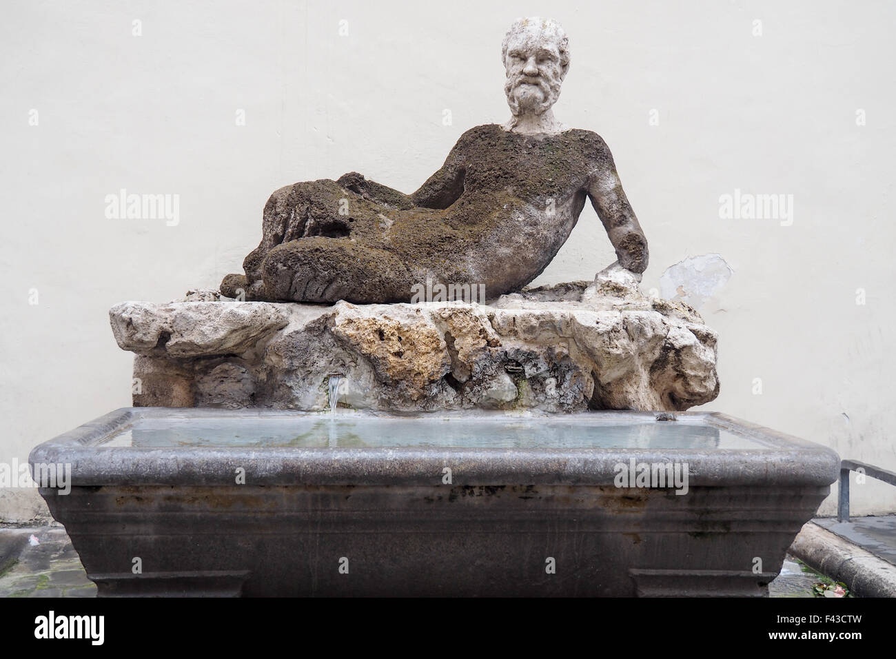 Fontana del Babuino, a fountain of a stone sculpture of a reclining ...