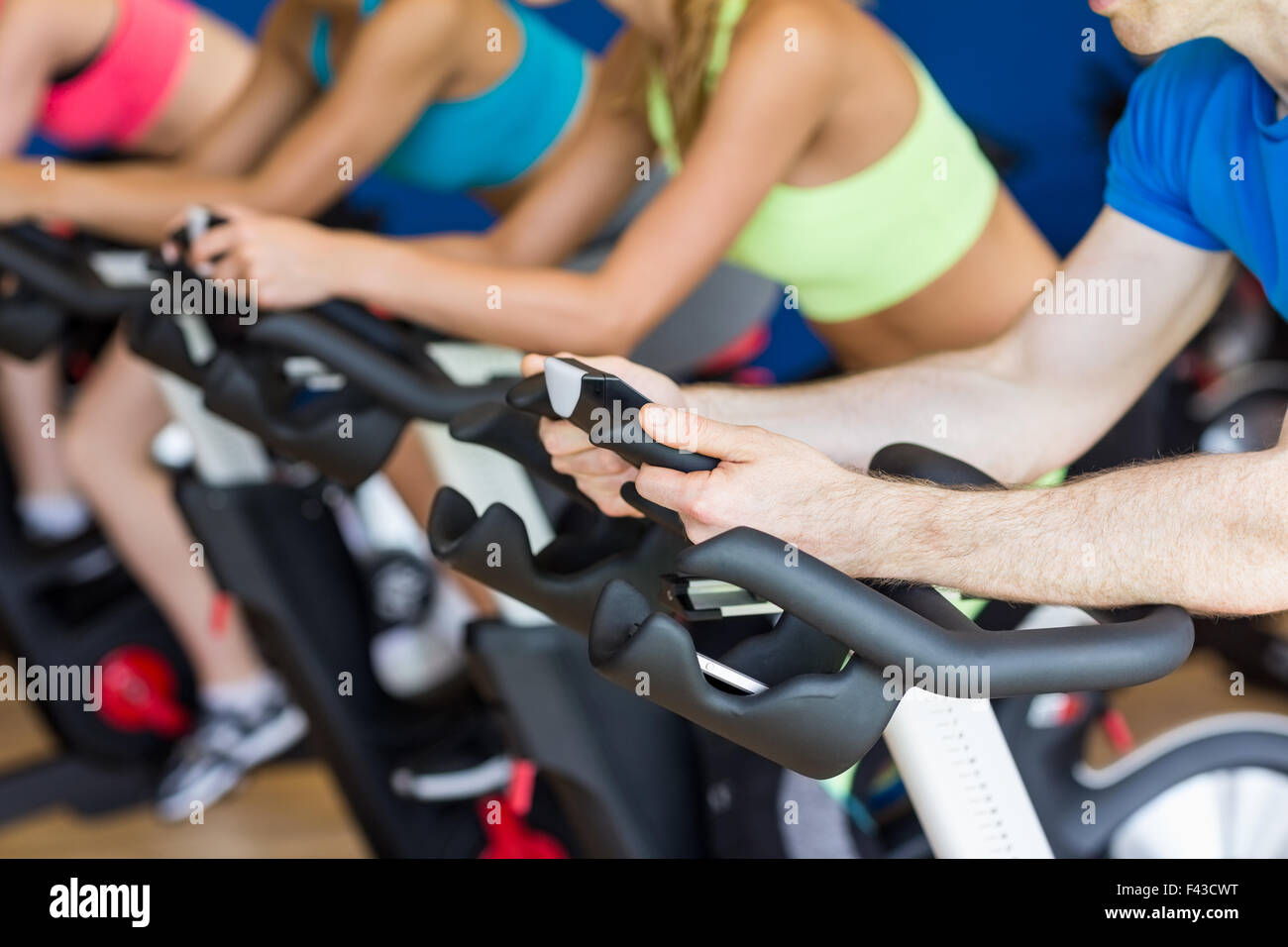 Fit people in a spin class Stock Photo - Alamy