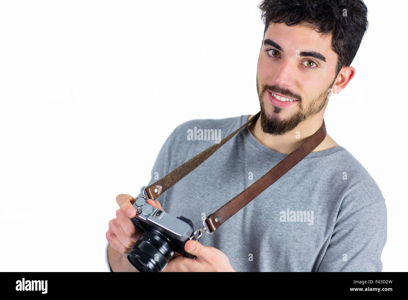 Casual man holding his camera Stock Photo - Alamy