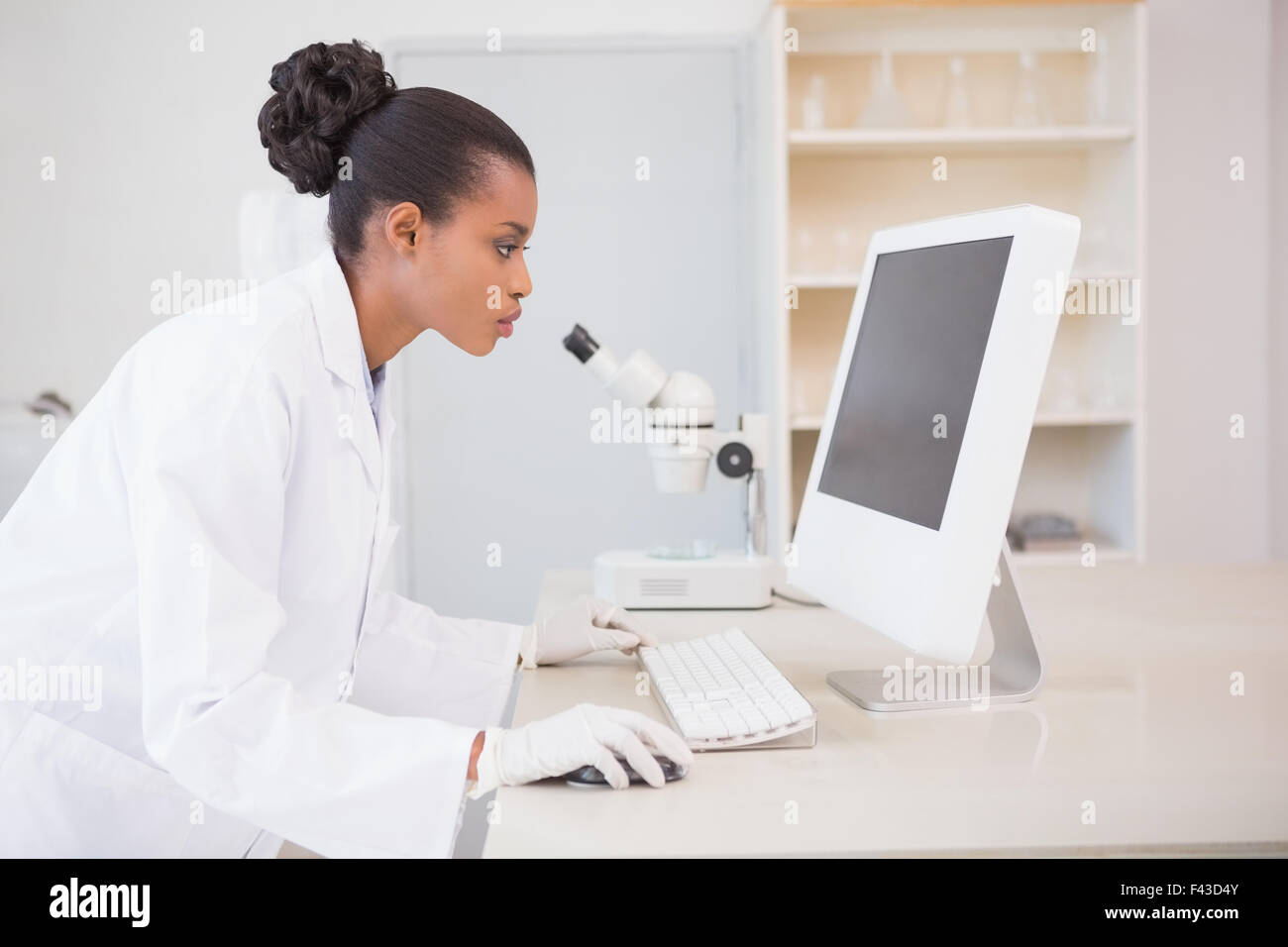 Concentrated scientist working with computer Stock Photo - Alamy