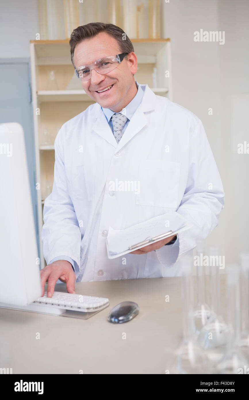 Smiling scientist using computer Stock Photo - Alamy