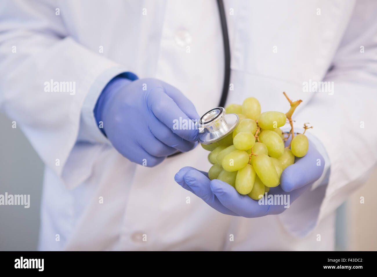 Scientist listening to grapes Stock Photo - Alamy