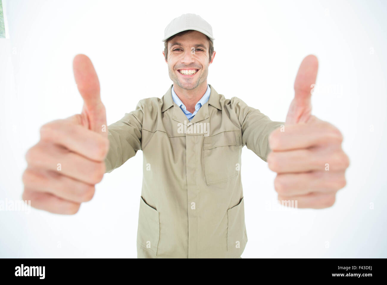 Happy delivery man showing thumbs up Stock Photo - Alamy