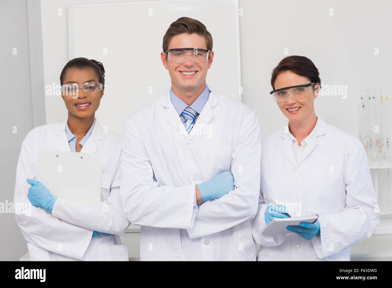 Scientists smiling and looking at camera Stock Photo - Alamy