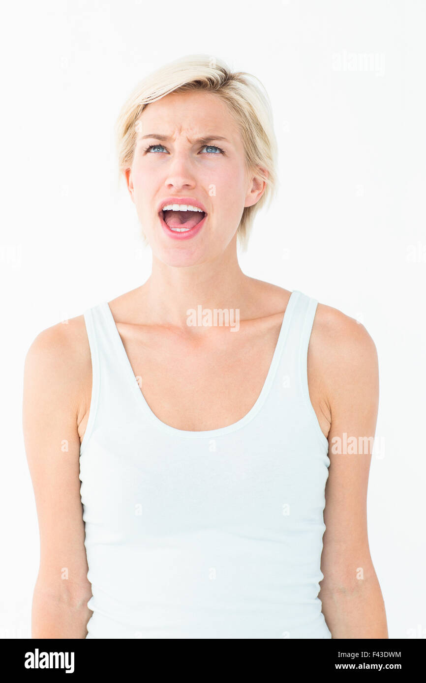 Upset blonde screaming Stock Photo - Alamy