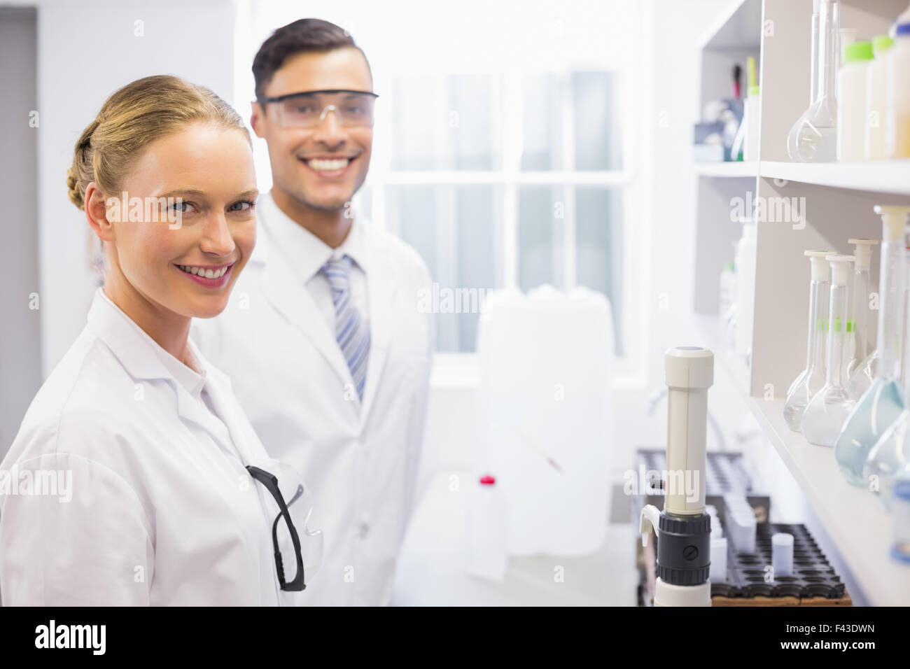 Smiling scientists looking at camera Stock Photo - Alamy