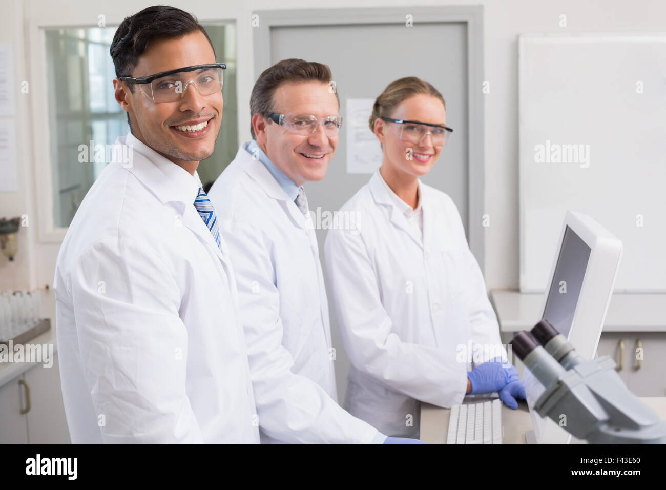 Smiling scientists looking at camera Stock Photo - Alamy