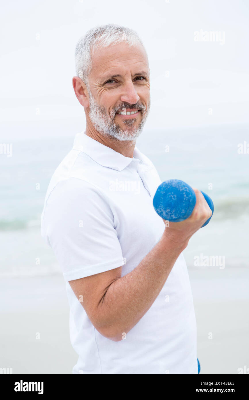 Fit man lifting dumbbells Stock Photo - Alamy