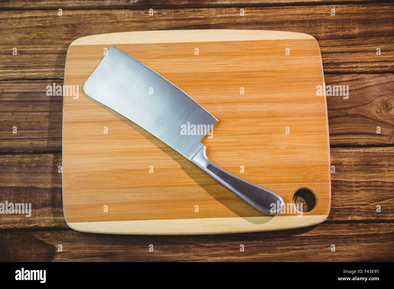 Chopping board with large knife Stock Photo - Alamy