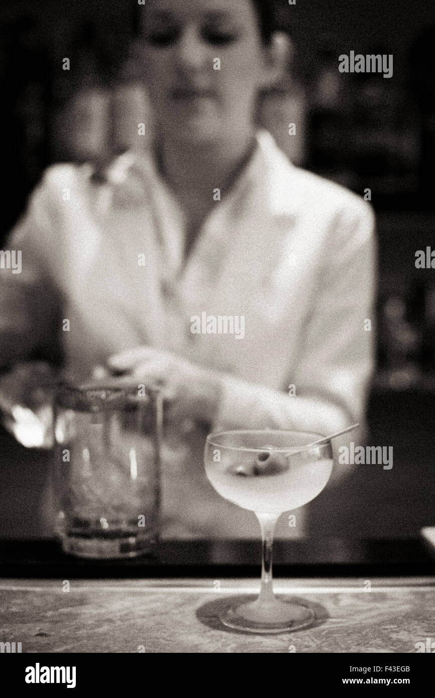 A woman mixing a cocktail, a mixologist at work Stock Photo - Alamy