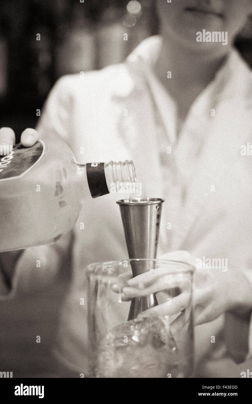 A woman mixing a cocktail, a mixologist at work Stock Photo - Alamy