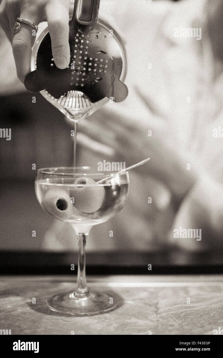 A woman mixing a cocktail, a mixologist at work Stock Photo - Alamy