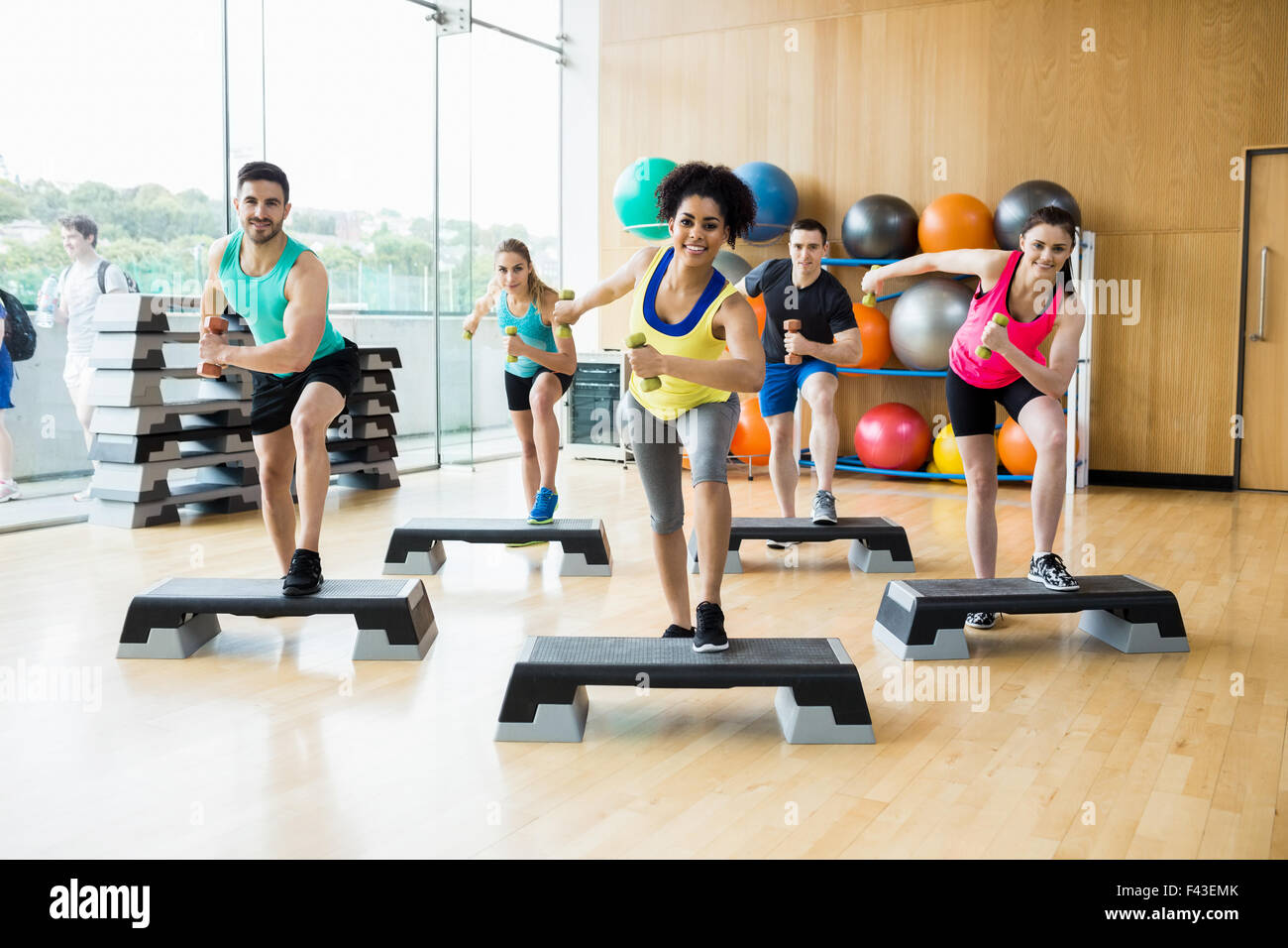 Fitness class exercising in the studio Stock Photo - Alamy