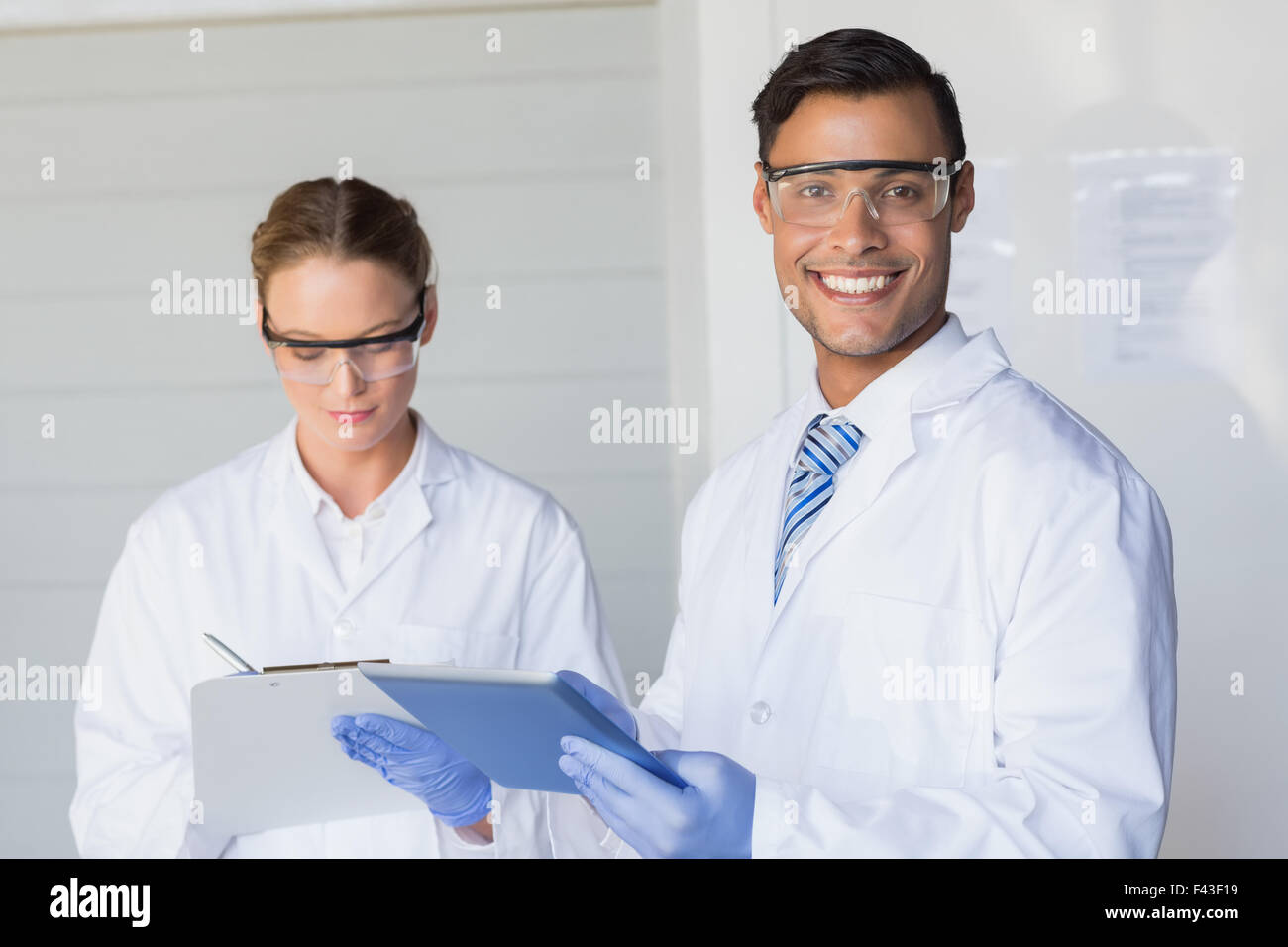 Woman taking notes observing hi-res stock photography and images - Alamy