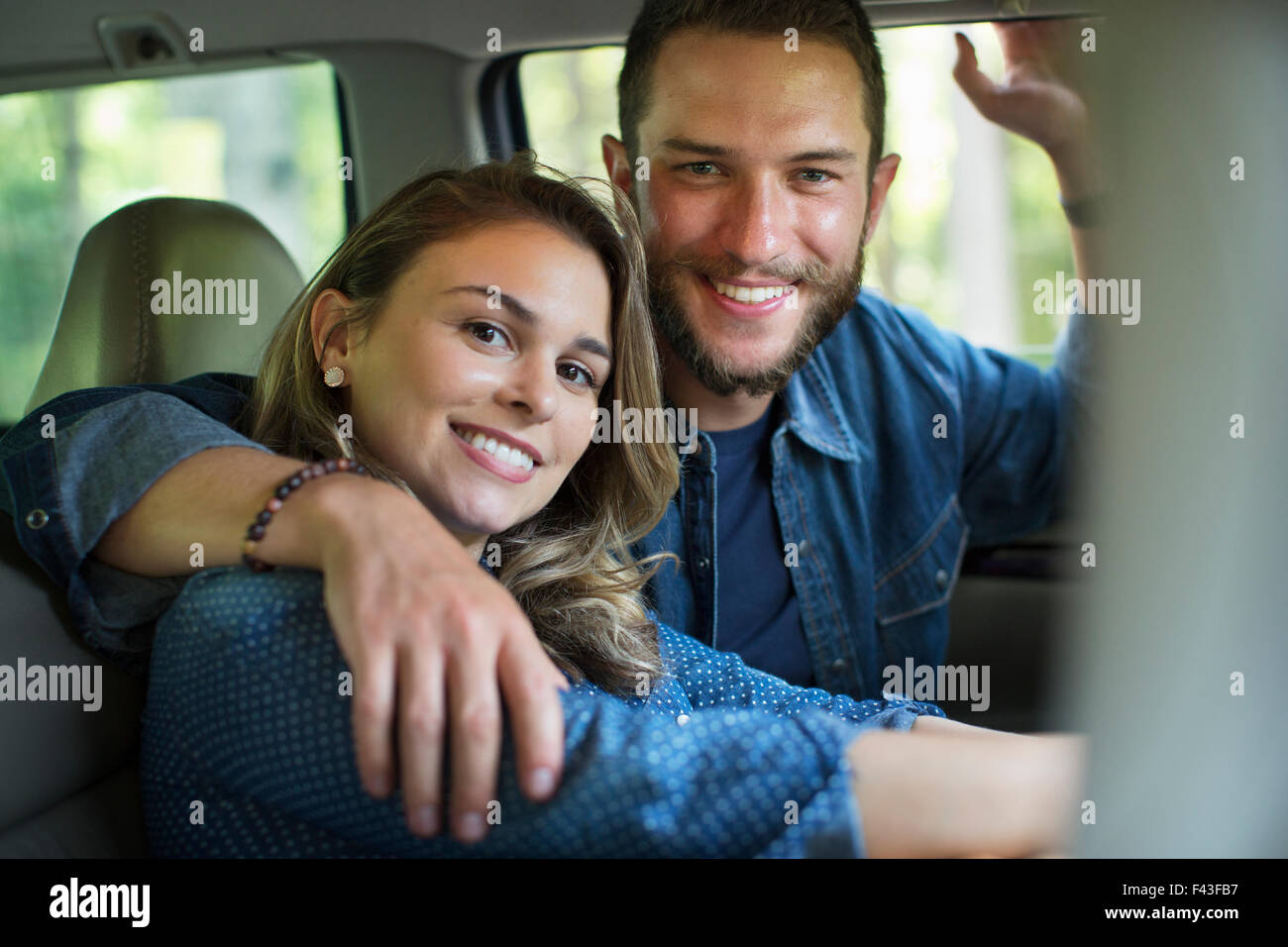 A couple, man and woman sitting inside a car Stock Photo - Alamy